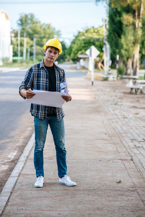 Architects Hold the Building Plan and Check the Work Stock Photo ...