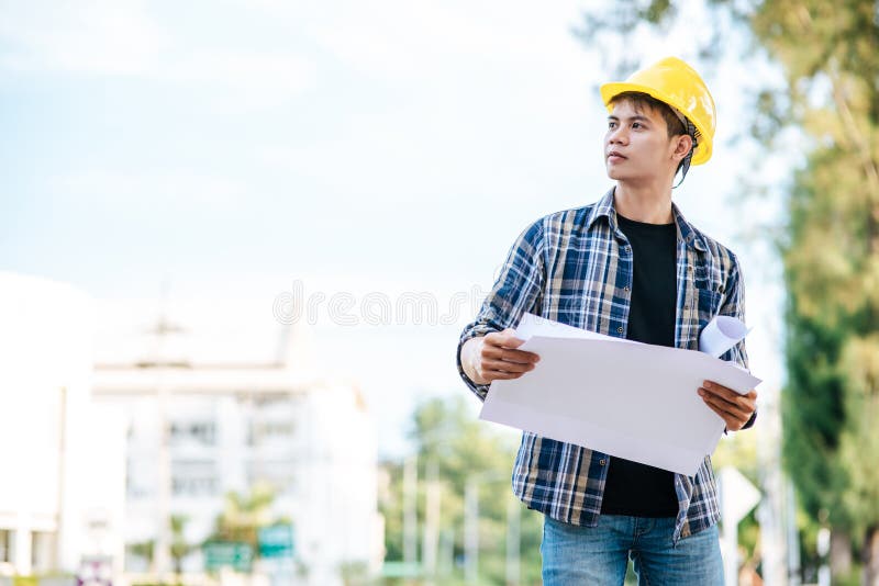 Architects Hold the Building Plan and Check the Work Stock Image ...