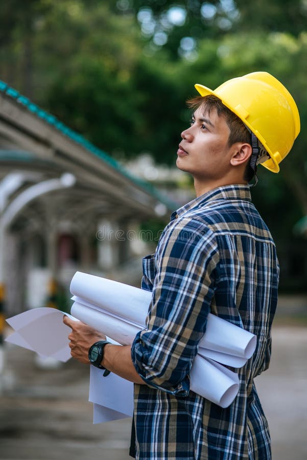Architects Hold the Building Plan and Check the Work Stock Photo ...