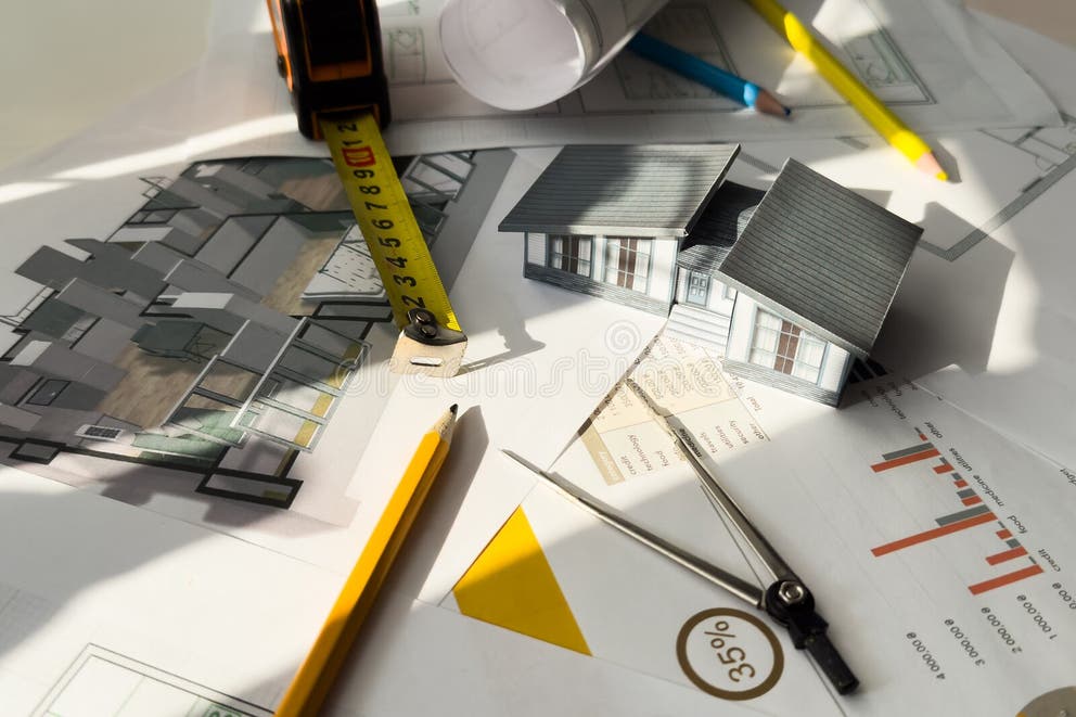 Architects House Model with Measurement Tool and Blueprints on ...