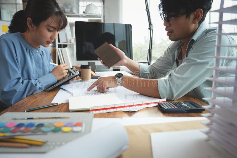 Architects and Interior Designers Woman Discussing about Concept of ...