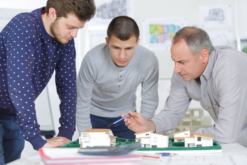 Architects Looking at Scale Model Housing Development Stock Image ...