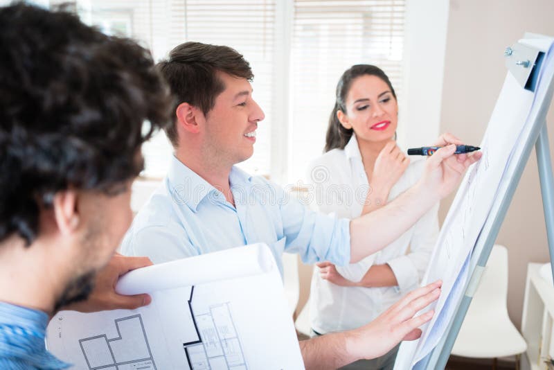 Architects Talk about Construction Plans at Flipchart Stock Photo ...