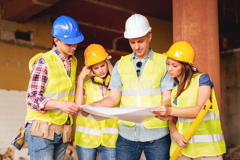 Architects Team Review Plan Stock Photo - Image of builder, holding ...