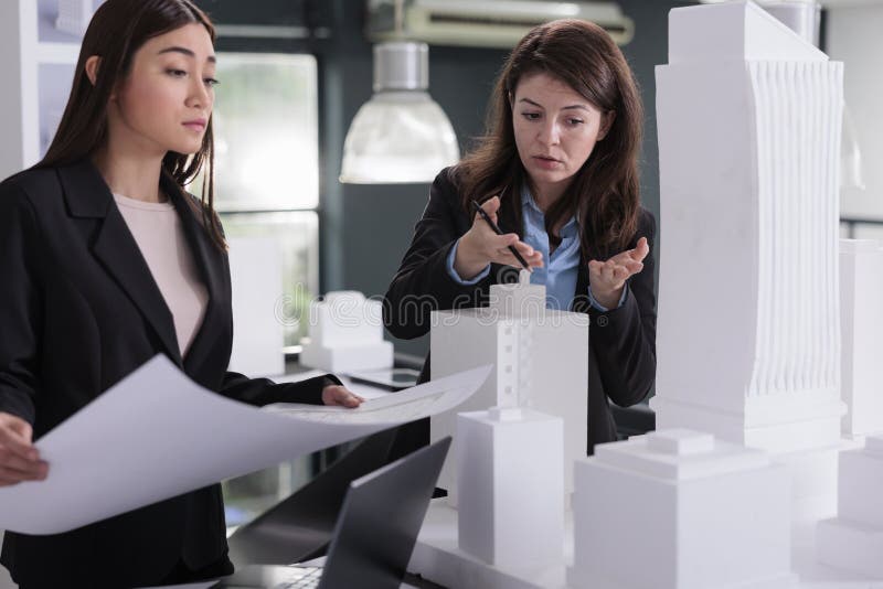 Architects Teamwork, Engineers Discussing Blueprint, Holding Building ...