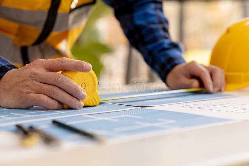 Architects are Using Tape Measure To Measure Building Plans, Architect ...