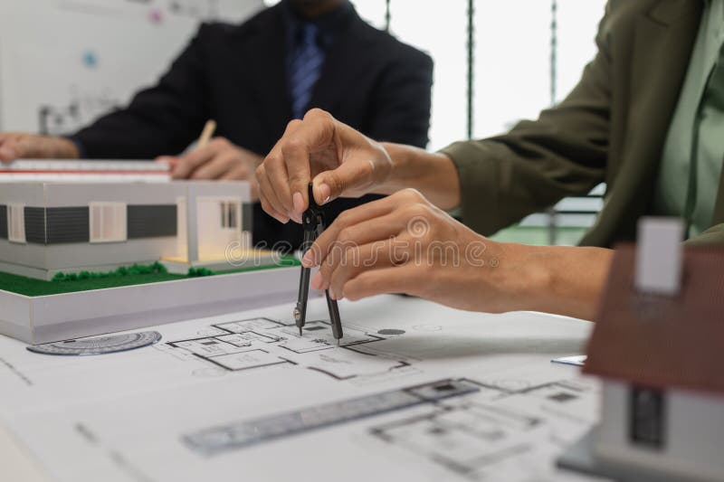 Architects Work with Engineers and Contractors in the Office To Check ...