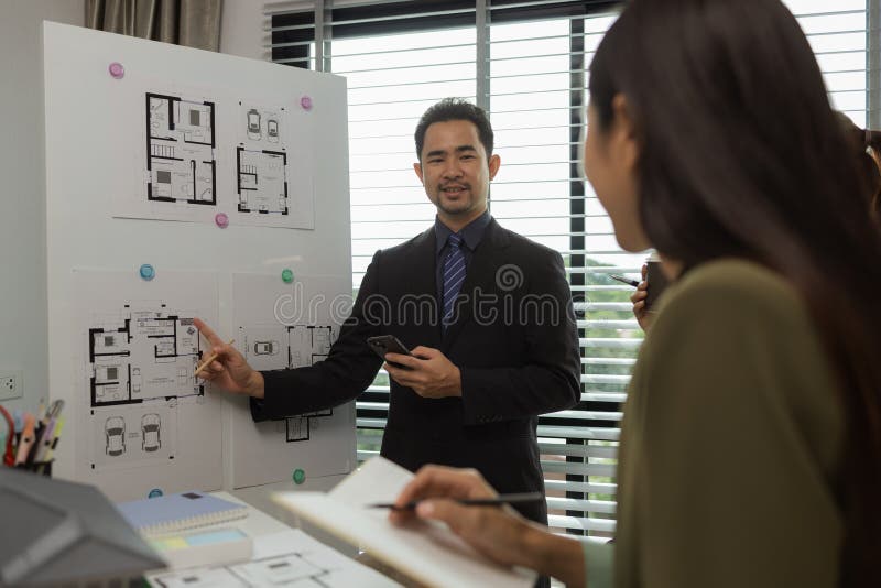 Architects Work with Engineers and Contractors in the Office To Check ...