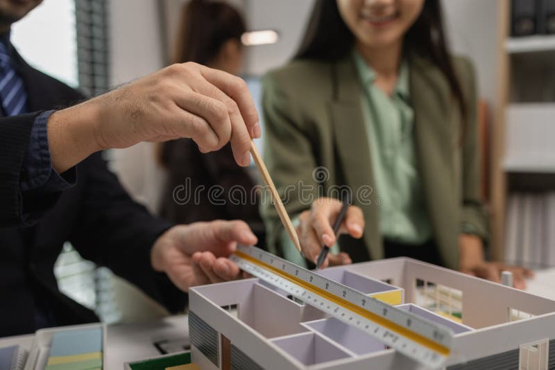 Architects Work with Engineers and Contractors in the Office To Check ...