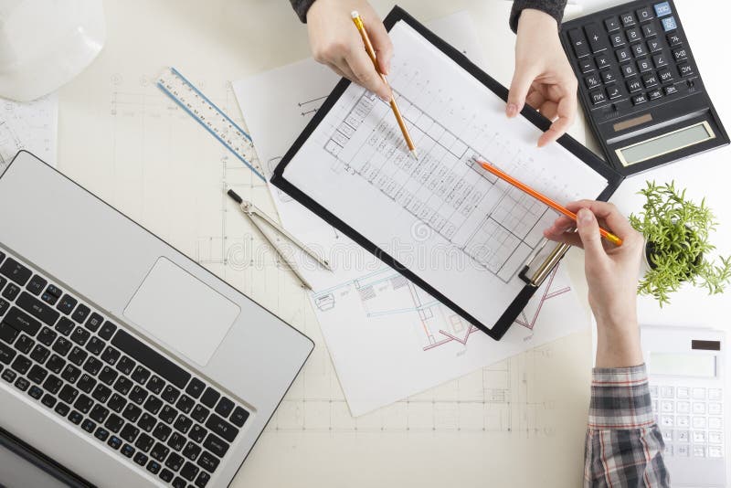Architects Working on Blueprint, Real Estate Project. Architect ... Architects Working on Blueprint, Real Estate Project. Architect ...