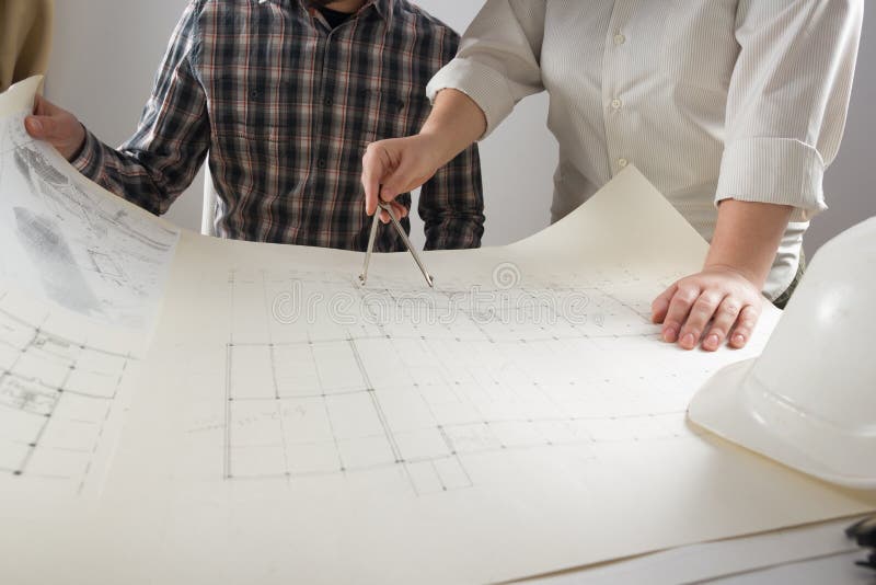 Architects Working on Blueprint, Real Estate Project. Architect ... Architects Working on Blueprint, Real Estate Project. Architect ...