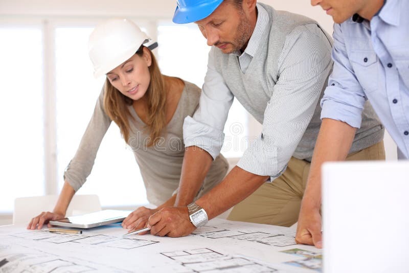 Architects Working Together in Office Stock Photo - Image of group ...