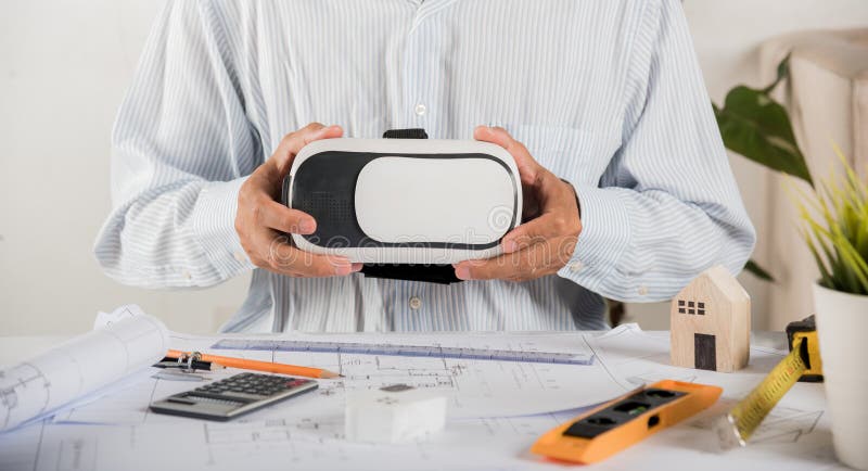 Architectural Building Design Holding 3D VR Glasses and Construction ...
