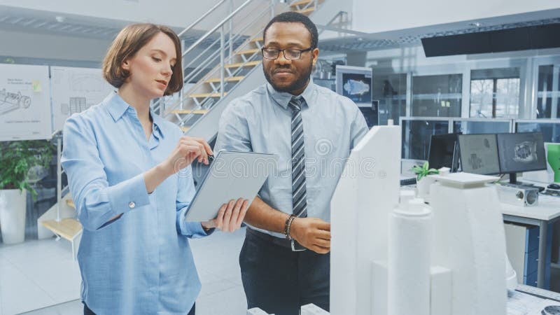 In Architectural Bureau: Architect and Engineer Talking, Working on a ...