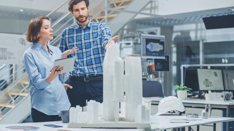 In Architectural Bureau: Architect and Engineer Talking, Working on a ...