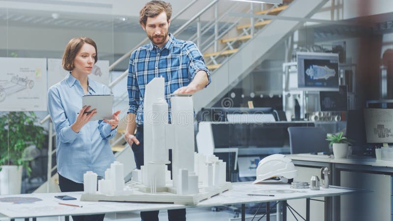 In Architectural Bureau: Architect and Engineer Talking, Working on a ...