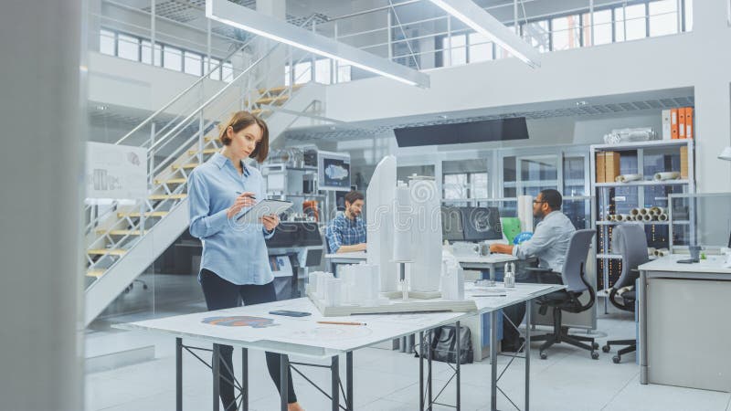 In Architectural Bureau: Team of Architects and Engineers Working on a ...