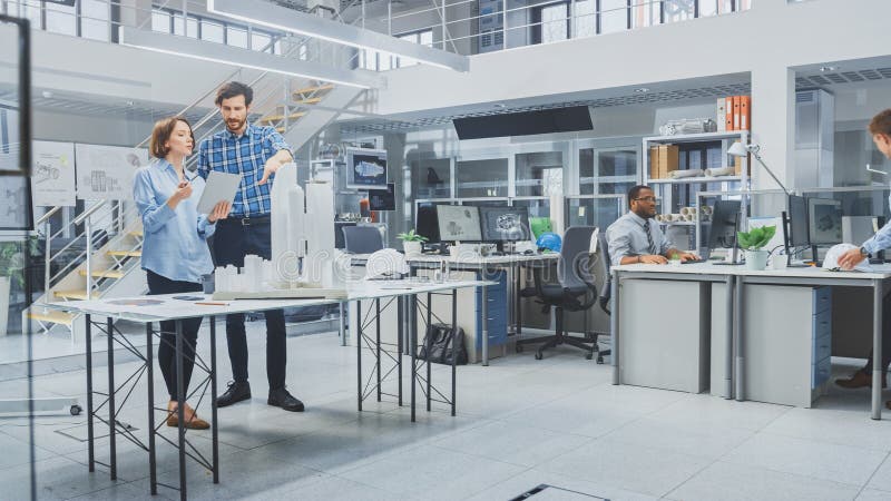 In Architectural Bureau: Team of Architects and Engineers Working on a ...