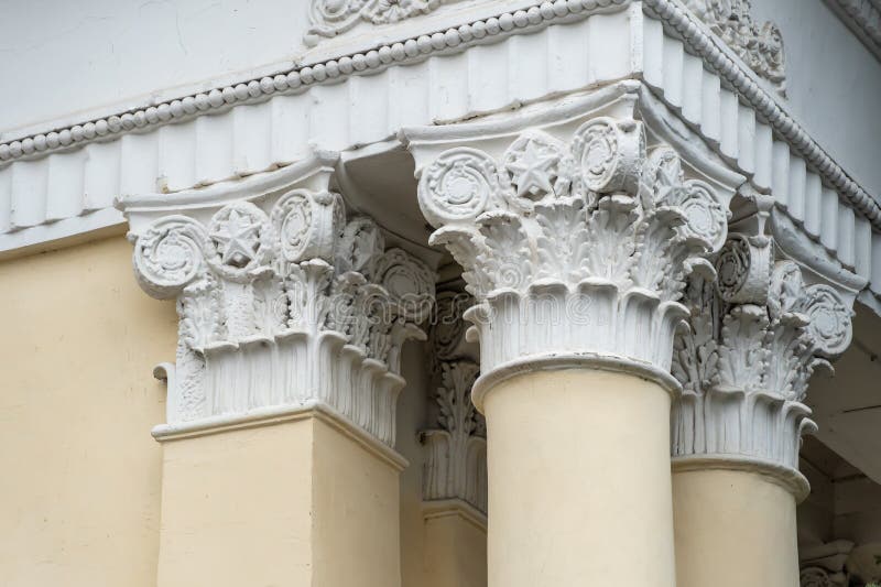 Architectural Columns with Figures and White Stucco Wealth. Stock Image ...