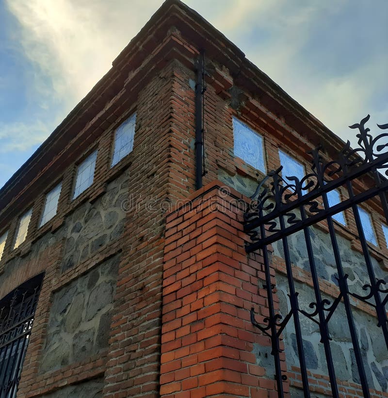 Architectural Detail: Corner of a Building: Brick Building with Wrought ...