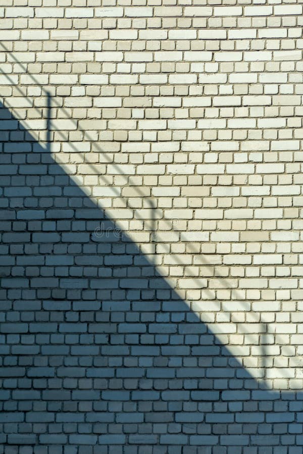 A Brick Wall with a Diagonal Shadow. Stock Photo - Image of white ...