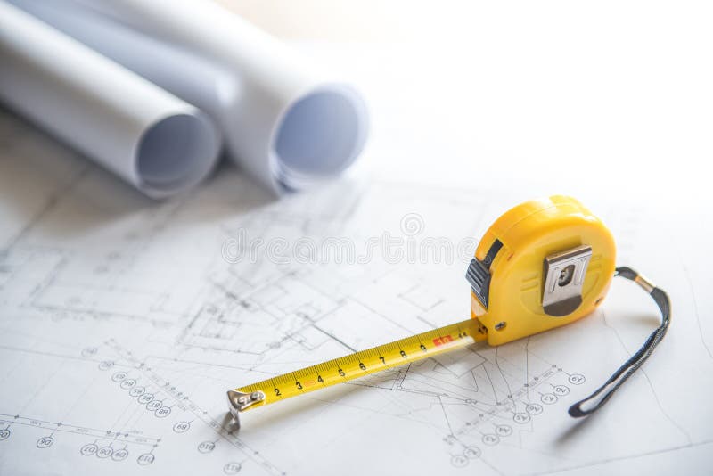 Architectural Drawing and Tape Measure on Work Table Stock Photo ...