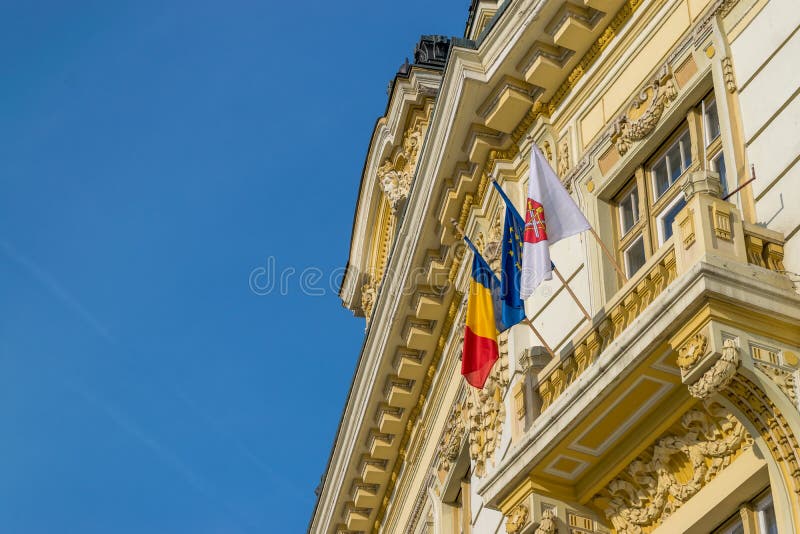 Architectural Element and the Romanian Flag, the EU One,and the Flag of ...