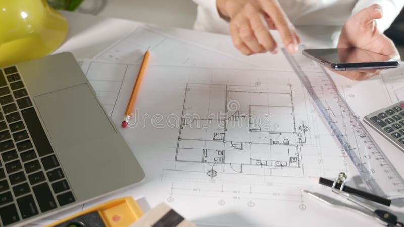 Architect Using Smartphone To Review Design of House before Editing ...