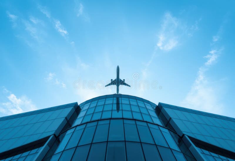 Architecture Building with Landing Airplane in Background Stock ...
