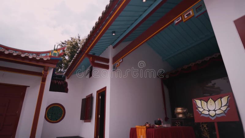 The Architecture of a Chinese Monastery with a Red Rooftop and a White ...