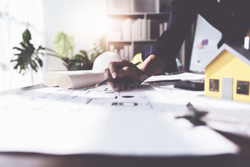 Architecture or Civil Engineer Analyze with Construction Blueprint ...