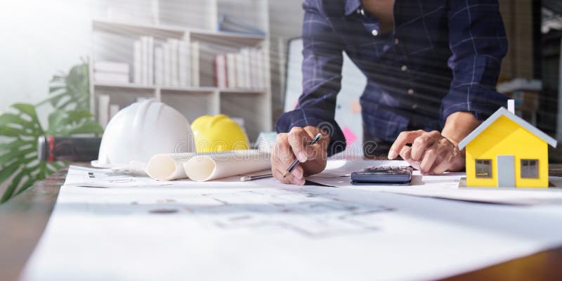 Architecture or Civil Engineer Analyze with Construction Blueprint ...