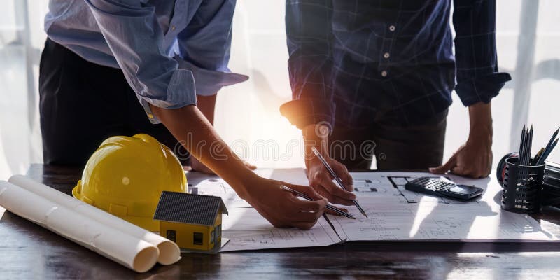 Architecture or Civil Engineer Team Analyze with Construction Blueprint ...