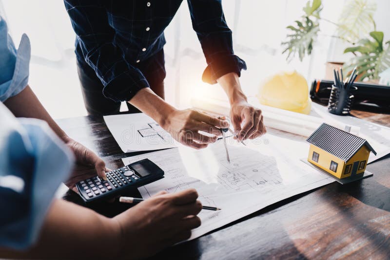 Architecture or Civil Engineer Team Analyze with Construction Blueprint ...