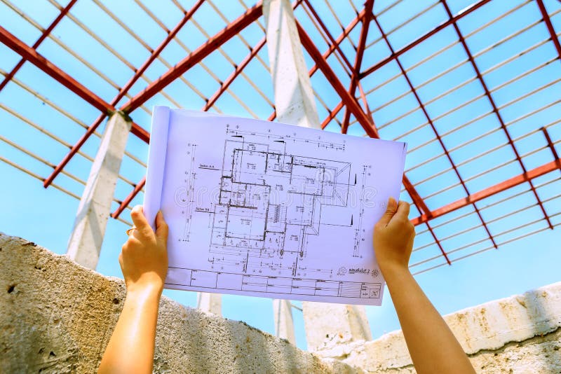 Architecture Drawings in Hand on House Building Stock Image - Image of ...