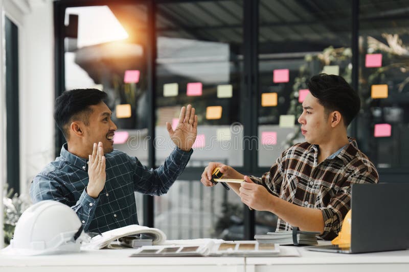 Architecture and Engineering Team Working Together at Construction Site ...