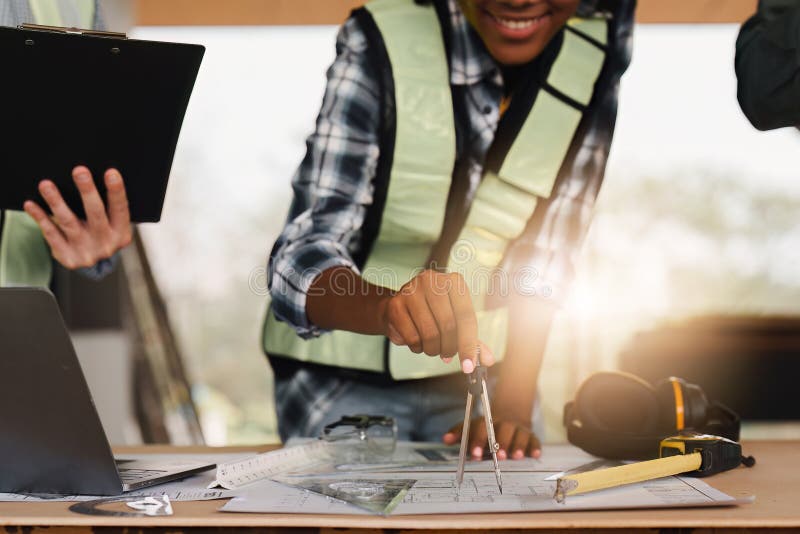 Architecture and Engineering Team Working Together at Construction Site ...