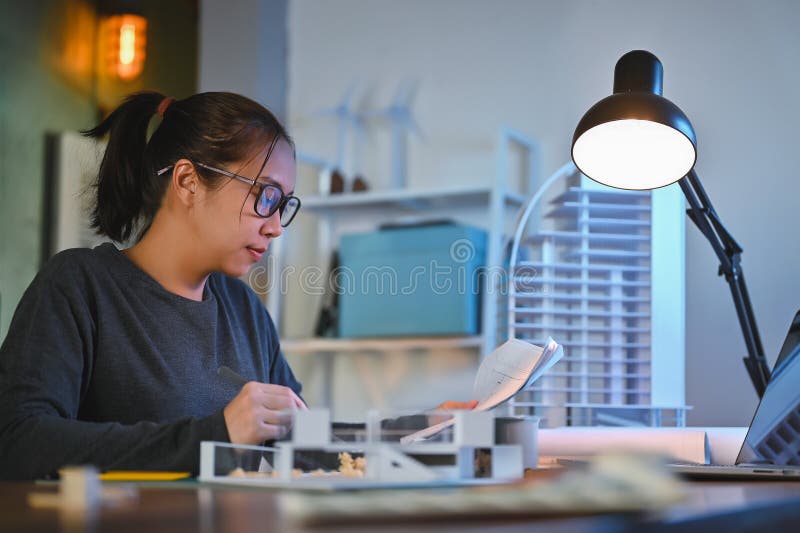 Architecture Students Diligently Study the Detail in Blueprints and ...