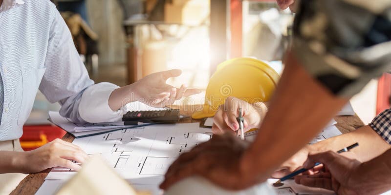 Architecture Team Drawing Something while Working with Blueprint in the ...