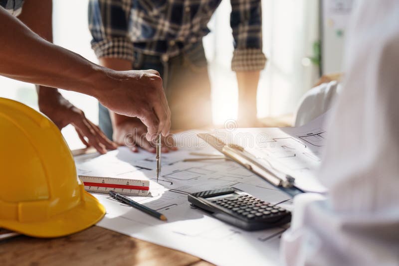 Architecture Team Drawing Something while Working with Blueprint in the ...