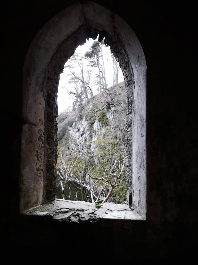 View of the Rocks through a Broken Window Stock Image - Image of window ...