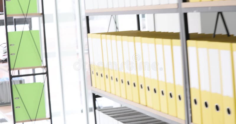Yellow Folders for Documents on Shelf in Company Office Stock Video ...