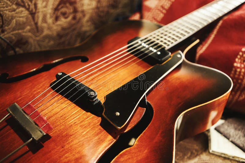 Archtop Jazz Acoustic Guitar on the Sofa Stock Photo - Image of ...