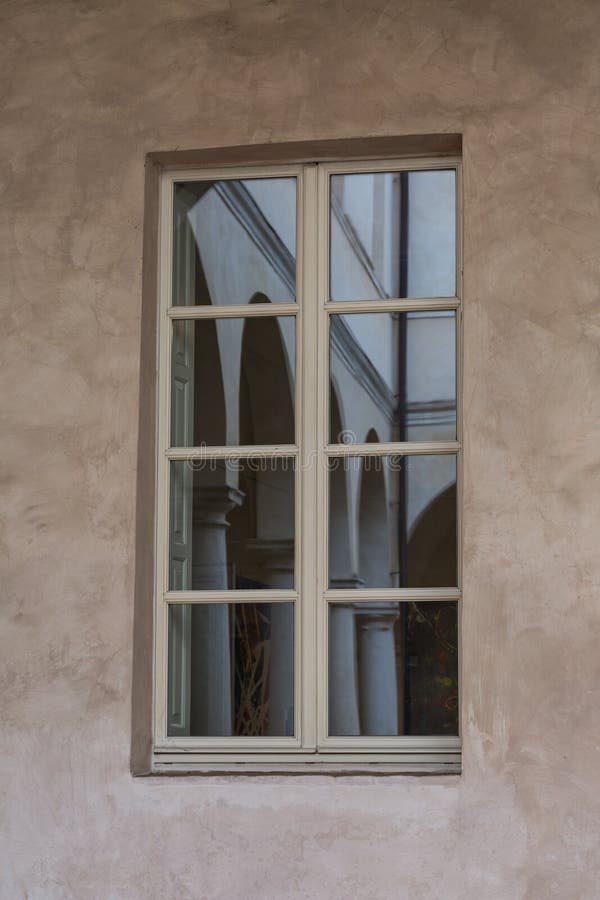 Archway, Columns and Courtyard: Reflected in the Glass of a Window ...