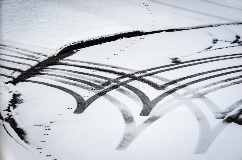 Arcing Pattern of Tire Tracks in Fresh Snow Stock Photo - Image of ...