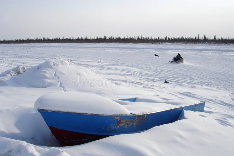 Arctic Blue Boat, Snowmobile & Dog Stock Image - Image of snowmobiling ...