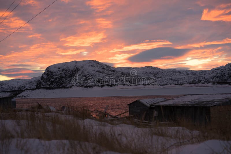 Arctic ocean at red sunset stock photo. Image of island - 211473108