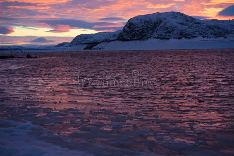Arctic ocean at red sunset stock image. Image of season - 211473109