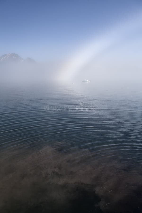 Arctic rainbow in Svalbard stock image. Image of ocean - 16576087