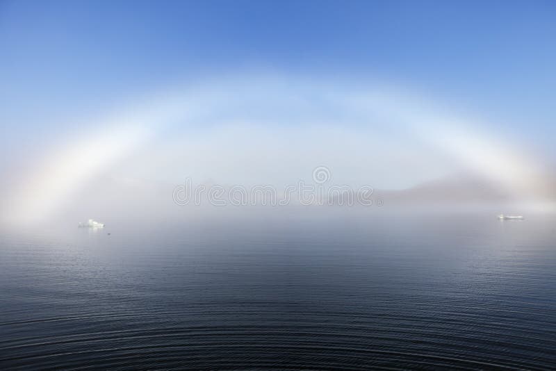 Arctic rainbow in Svalbard stock image. Image of ocean - 16576087